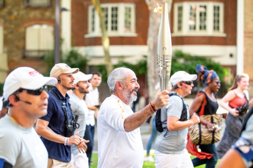 Kiss of fire: Nando’s Brozin bears Olympic torch - Jewish Report